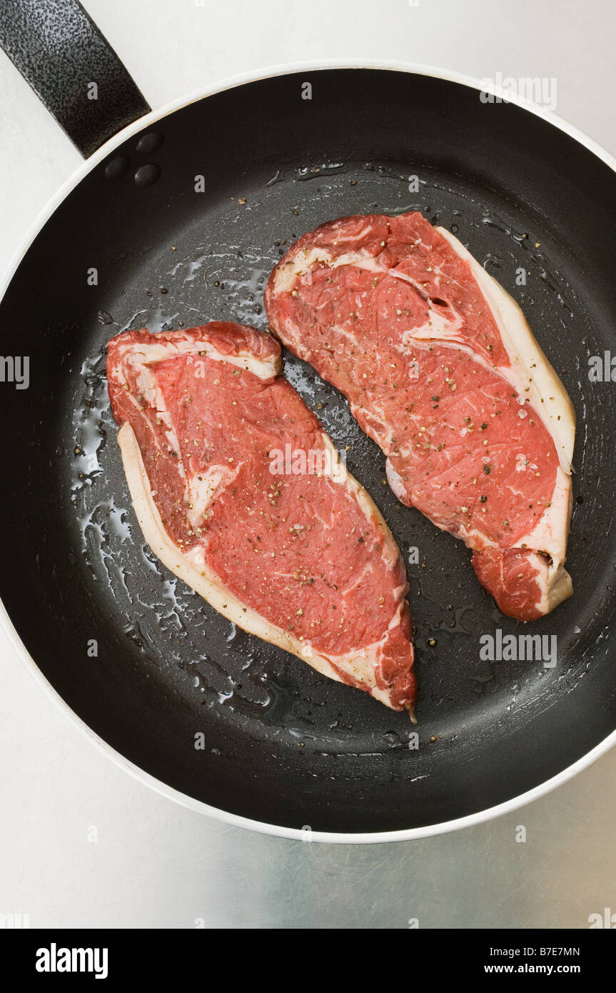Cook in a frying pan hi-res stock photography and images - Alamy
