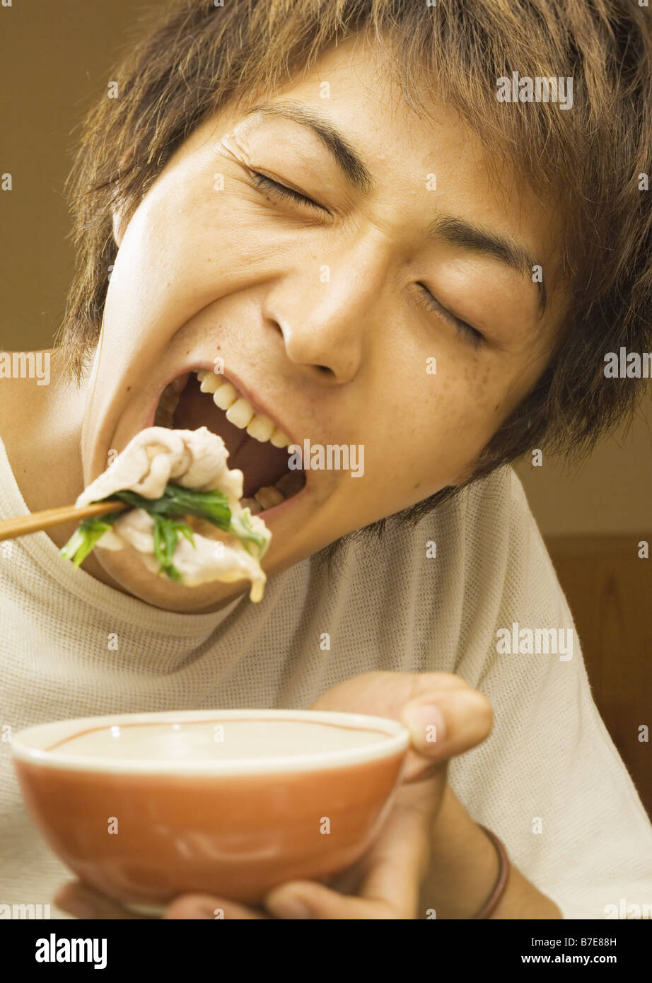 Man Eating Beef One-Pot Stock Photo - Alamy