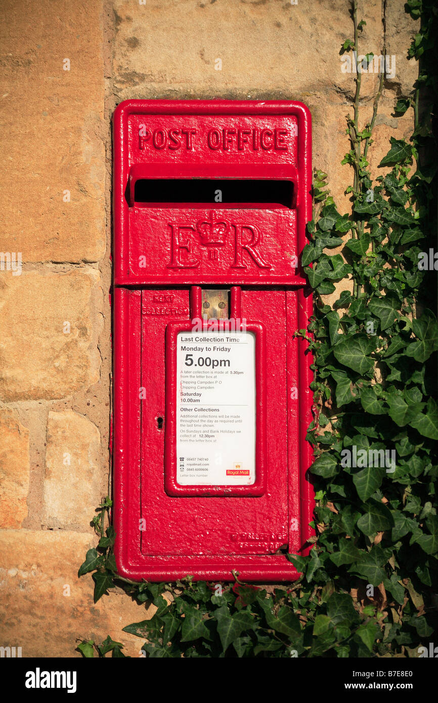 Red letter box in the limestone wall in Cotswolds England Stock Photo ...