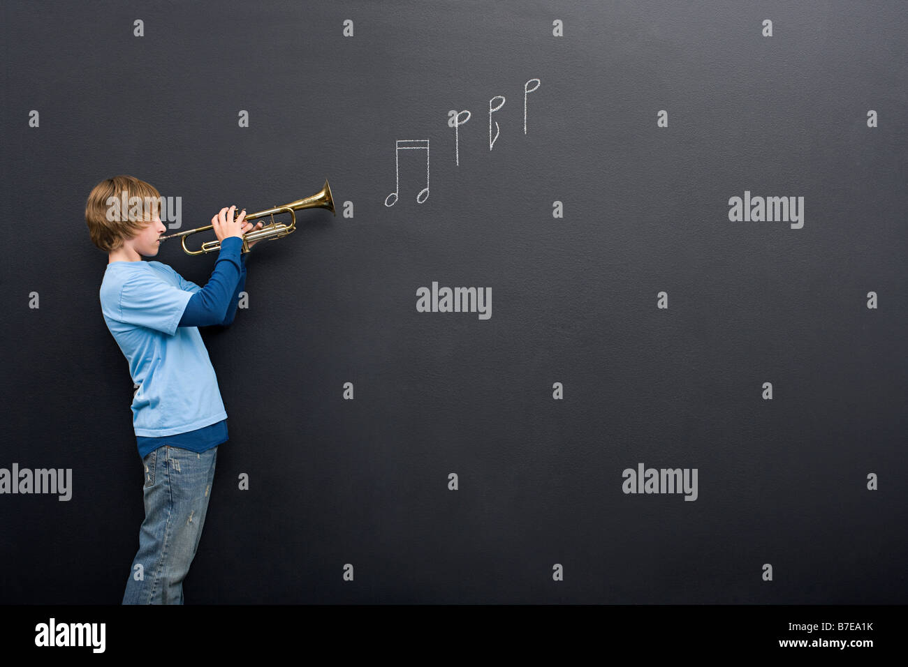 A boy playing the trumpet Stock Photo - Alamy