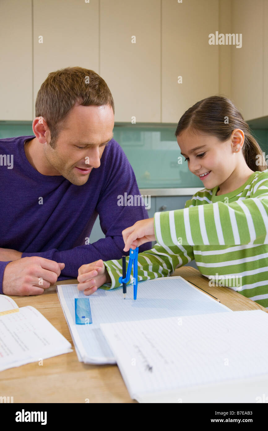 Father helping his daughter with homework Stock Photo - Alamy
