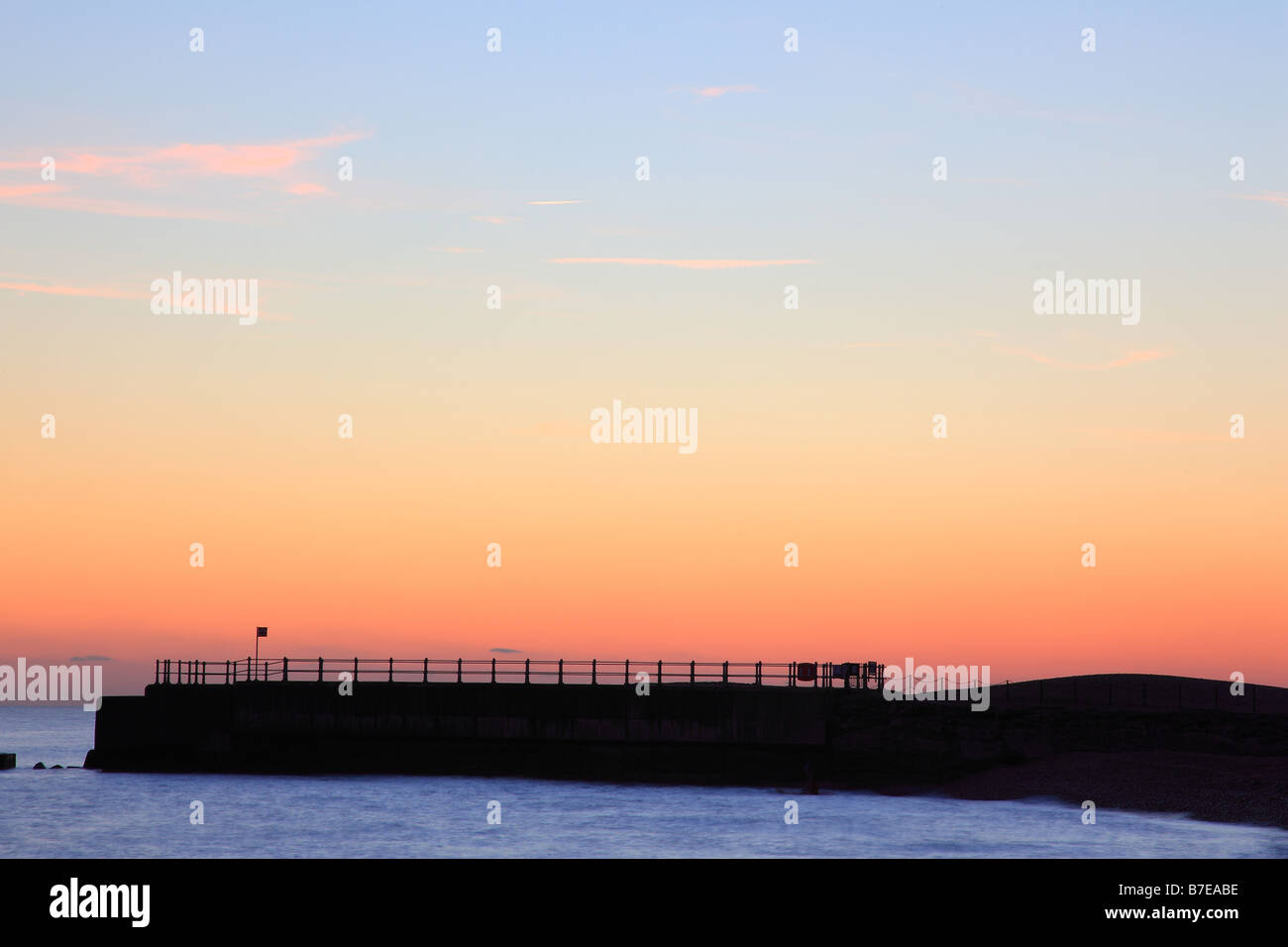 Sunset by the sea in Hastings England Stock Photo - Alamy
