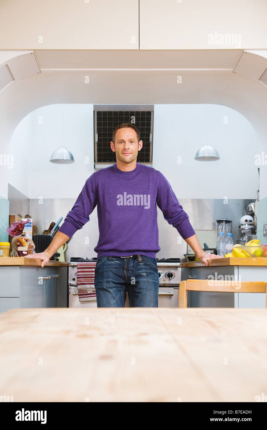 Portrait of a man in a kitchen Stock Photo - Alamy
