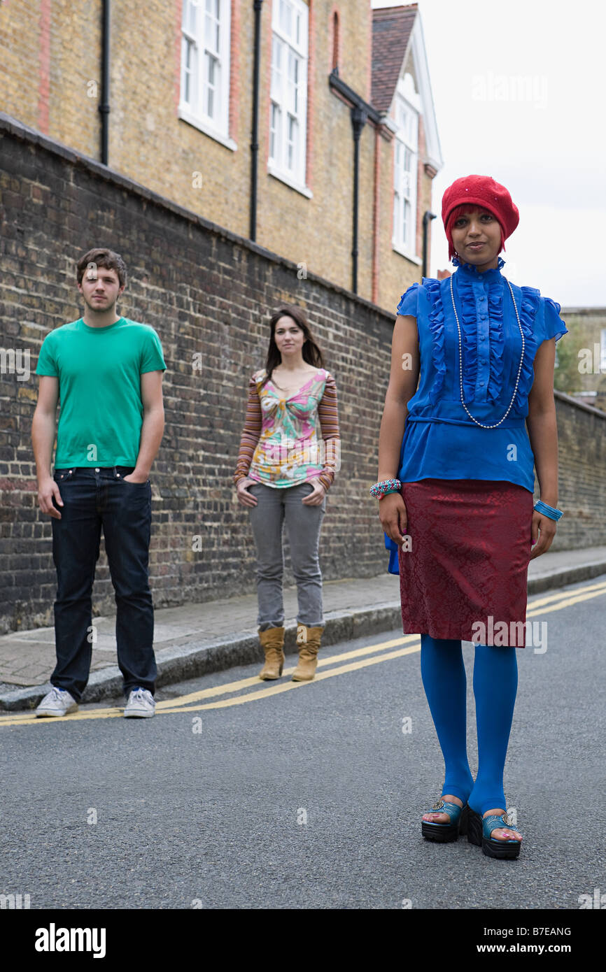 Young people standing in street Stock Photo - Alamy