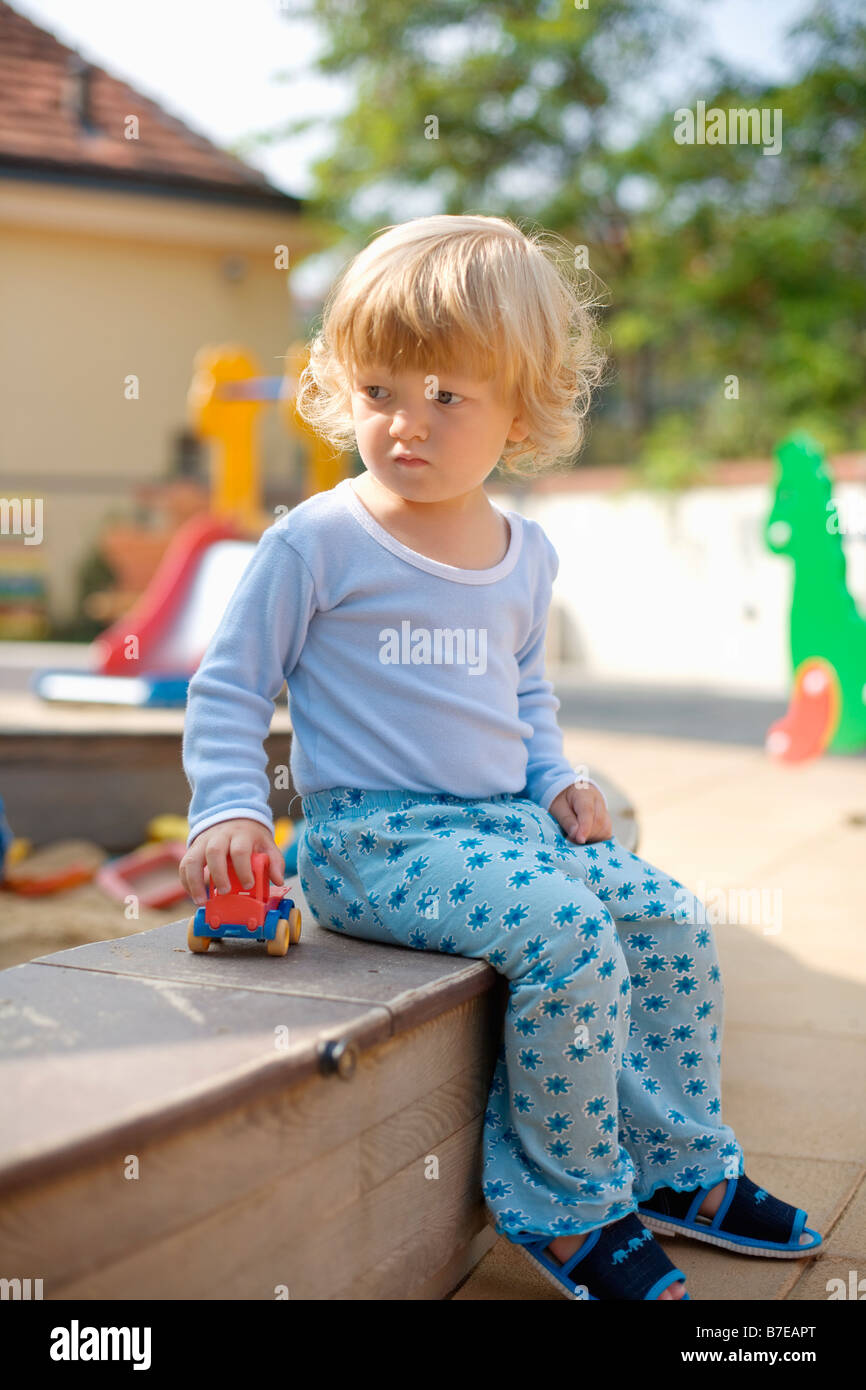 BOY AGE 2 YEARS AT THE PLAYGROUND Stock Photo - Alamy
