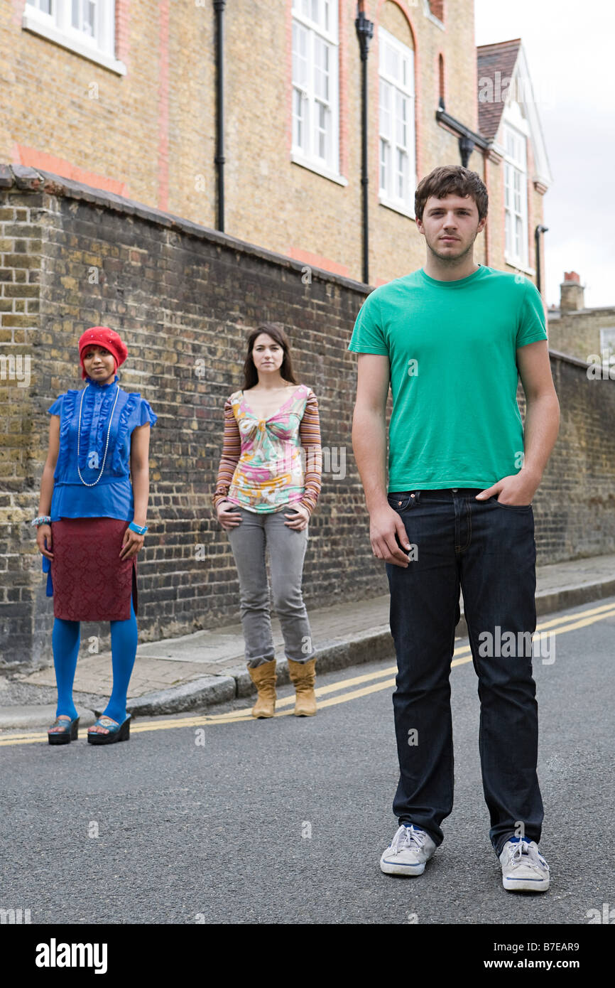 Young people standing in street Stock Photo - Alamy