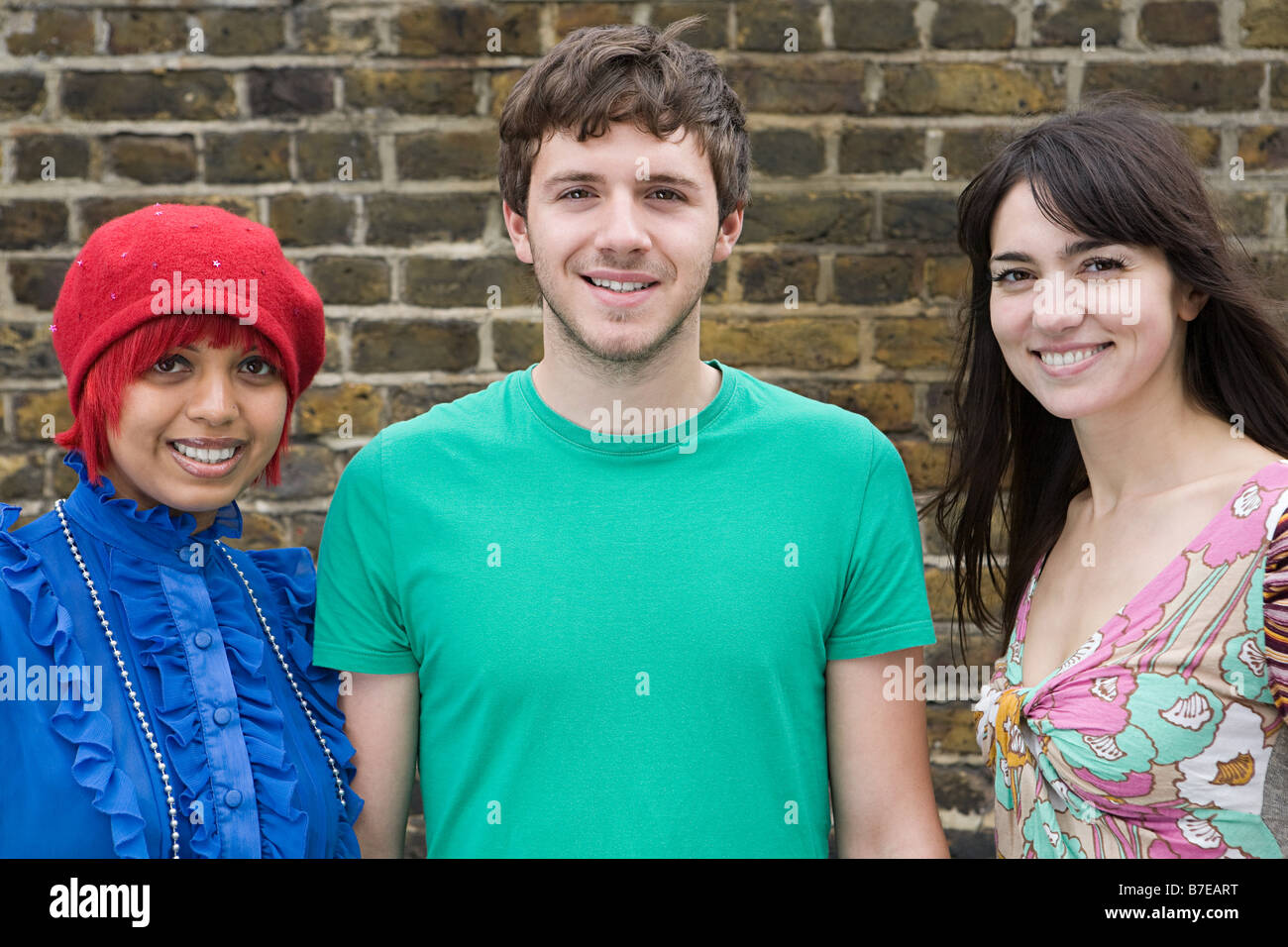 Three young people Stock Photo - Alamy