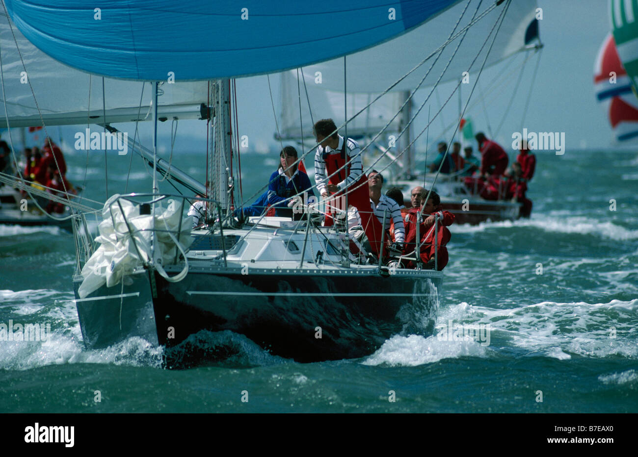 Annual sailing regatta Yacht sailing down wind Spinnaker sail up Crew ...