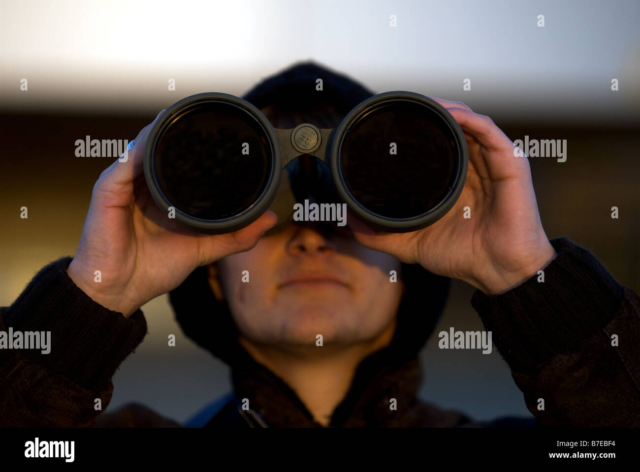 Plane spotter using powerful binoculars to watch aircraft at Dusseldorf ...