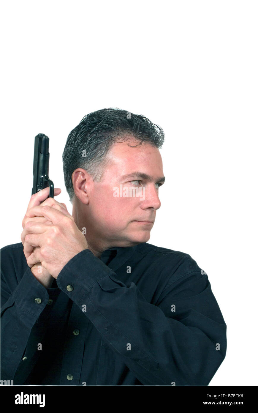 man with an automatic pistol ready for action Stock Photo - Alamy