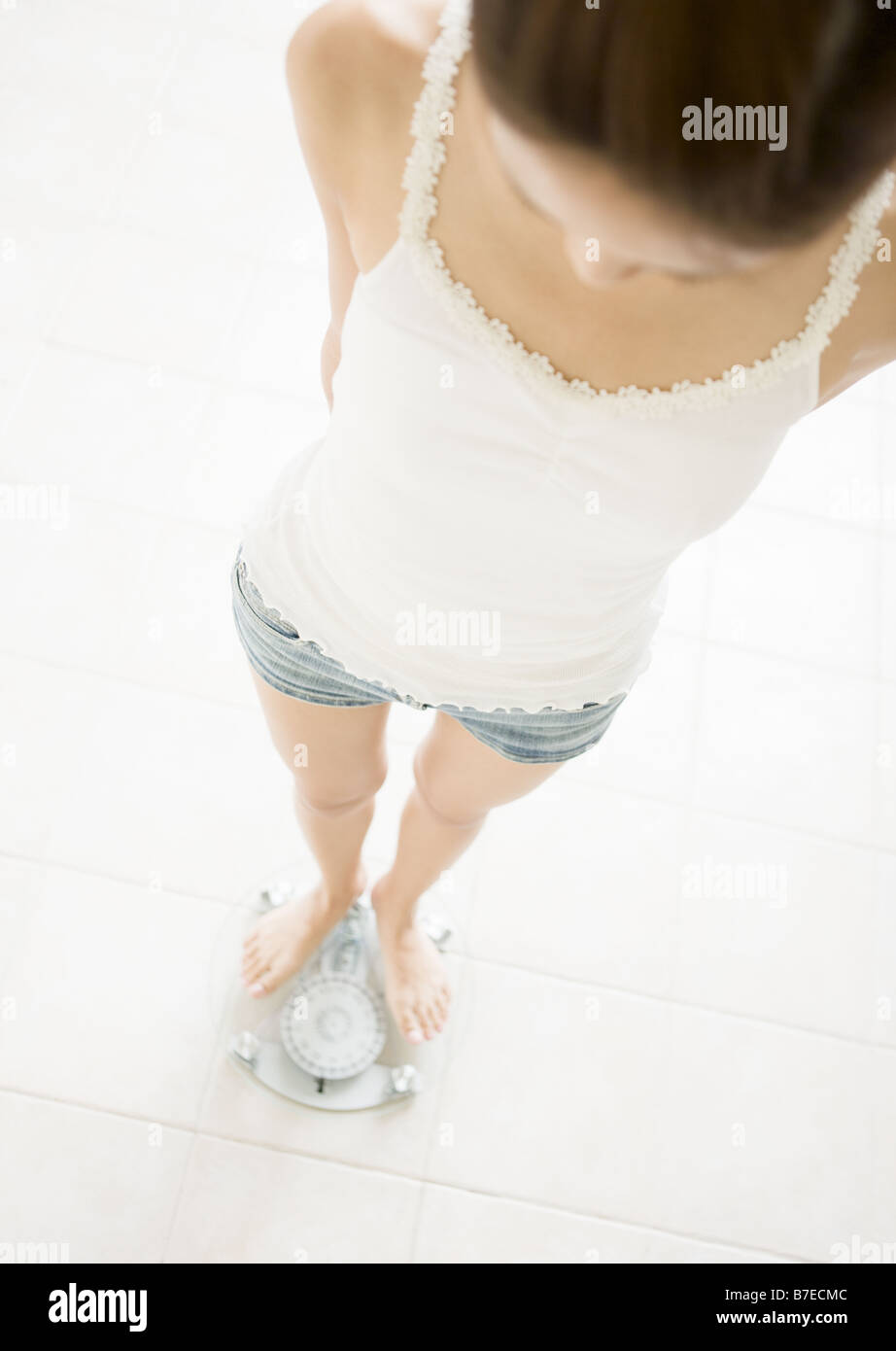 Woman on the scale Stock Photo - Alamy