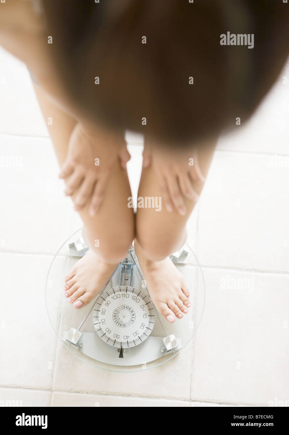 Woman on the scale Stock Photo - Alamy