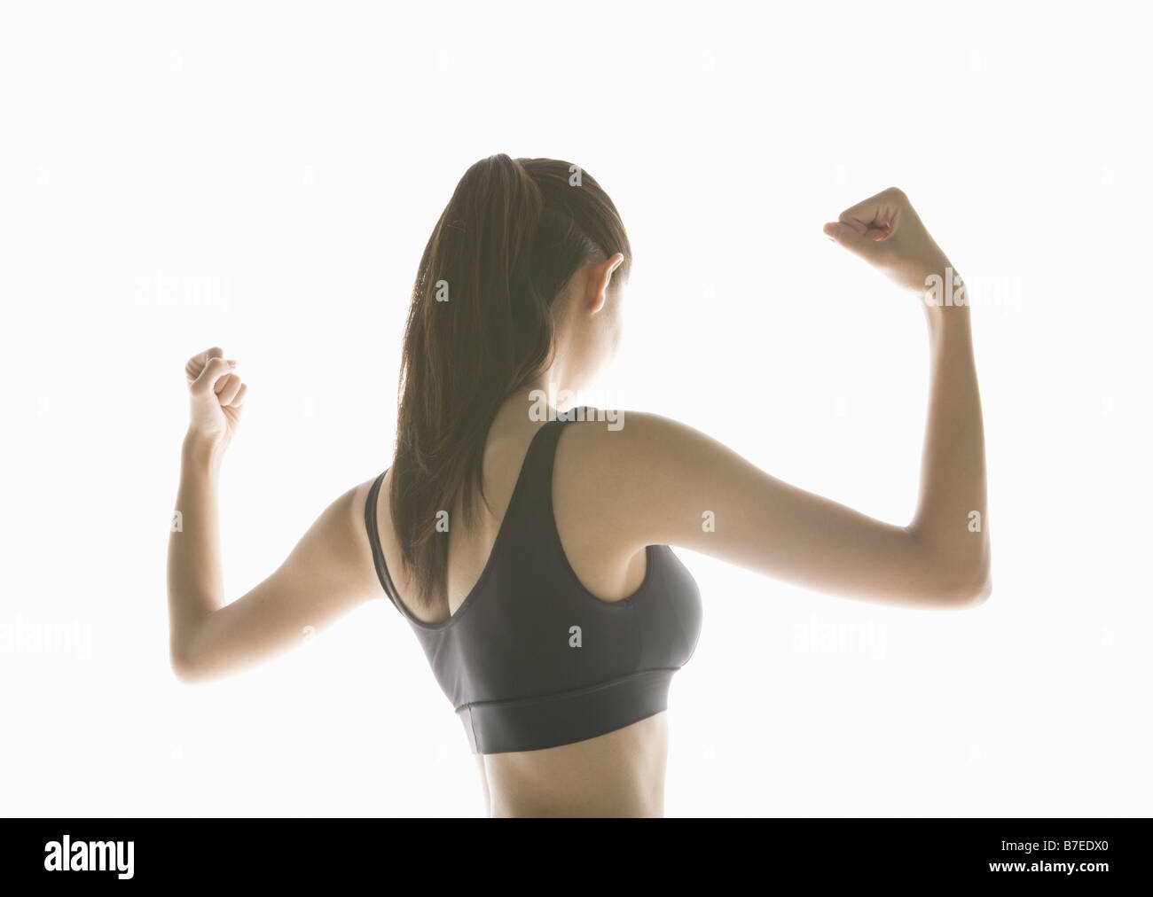 Rear view of young woman Stock Photo - Alamy