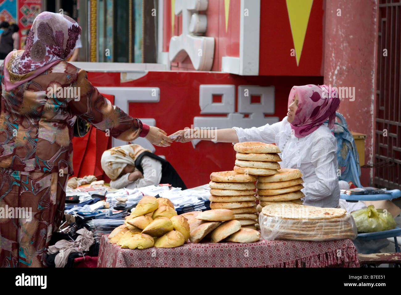 Selling bread at a stall on the streetside in Urumqi capital of ...