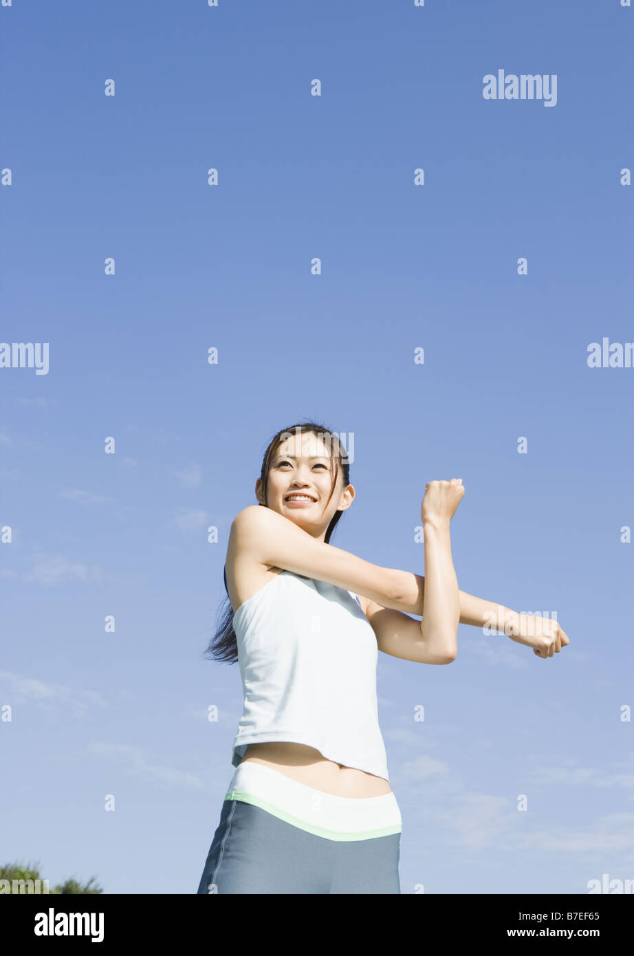 Woman doing a stretching exercise Stock Photo - Alamy