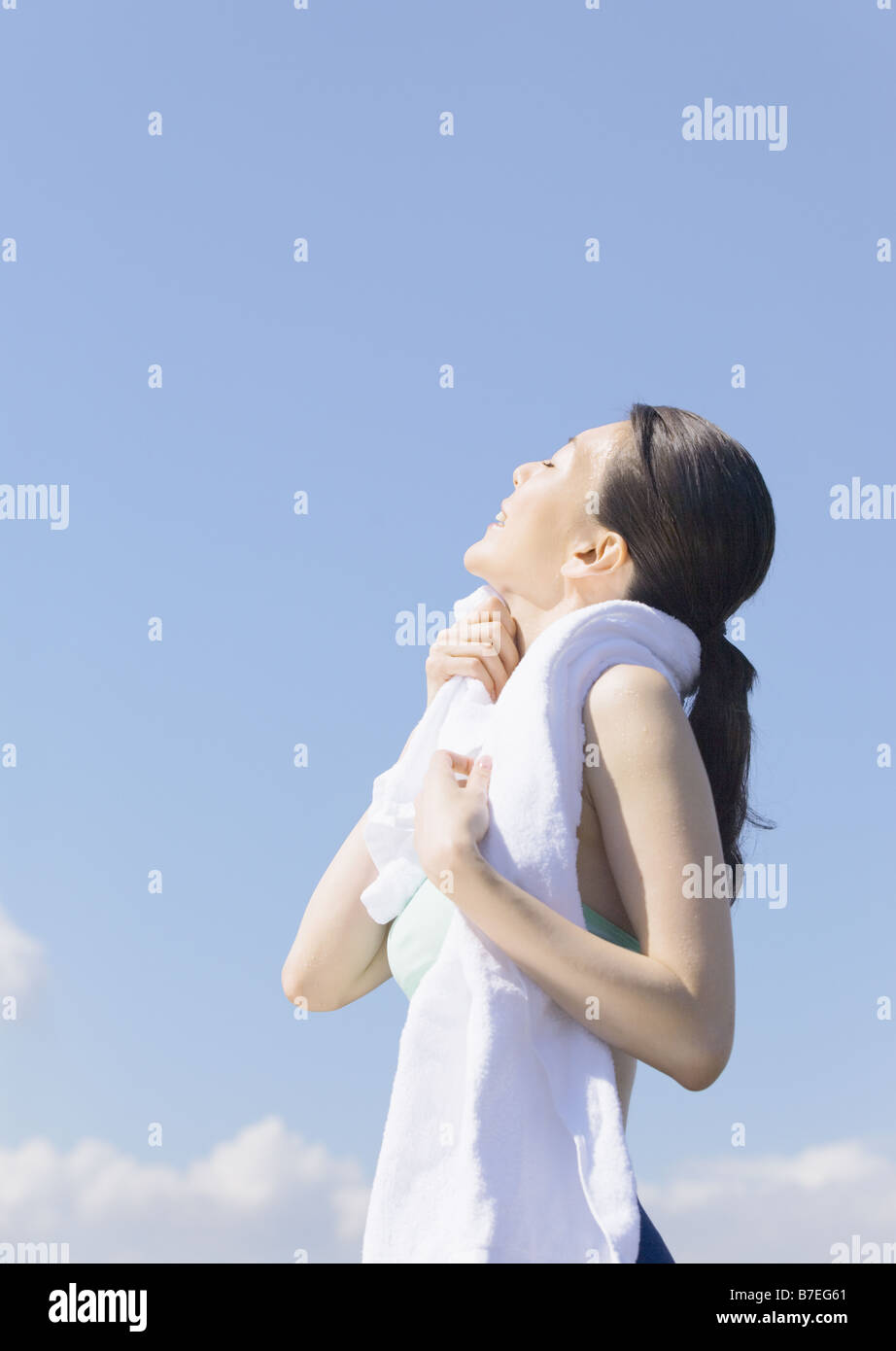 Woman wiping sweat Stock Photo - Alamy