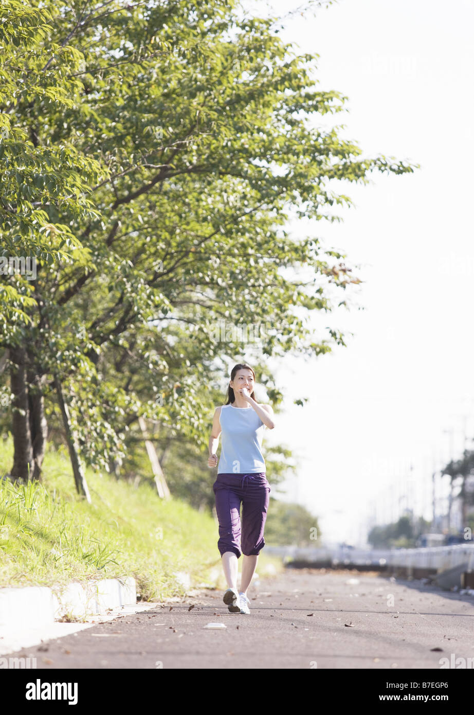 Woman tracksuit walking hi-res stock photography and images - Alamy