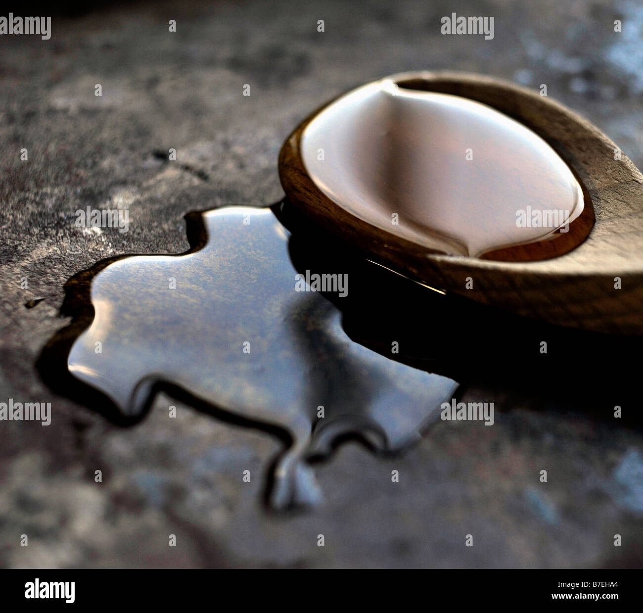 honey overflowing from wooden spoon Stock Photo - Alamy