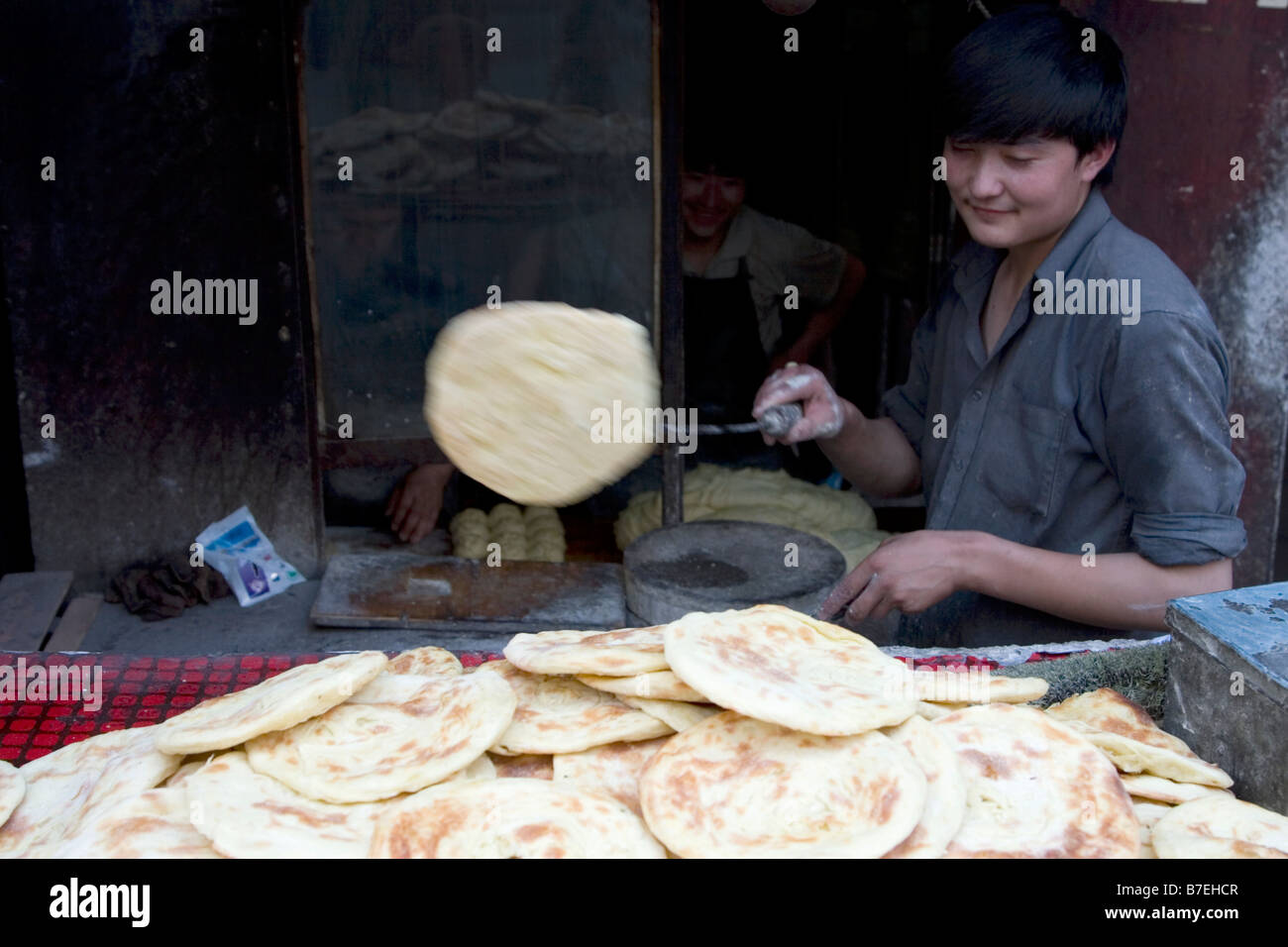 A bakery selling flat bread in Urumqi capital of Xinjiang China Stock ...