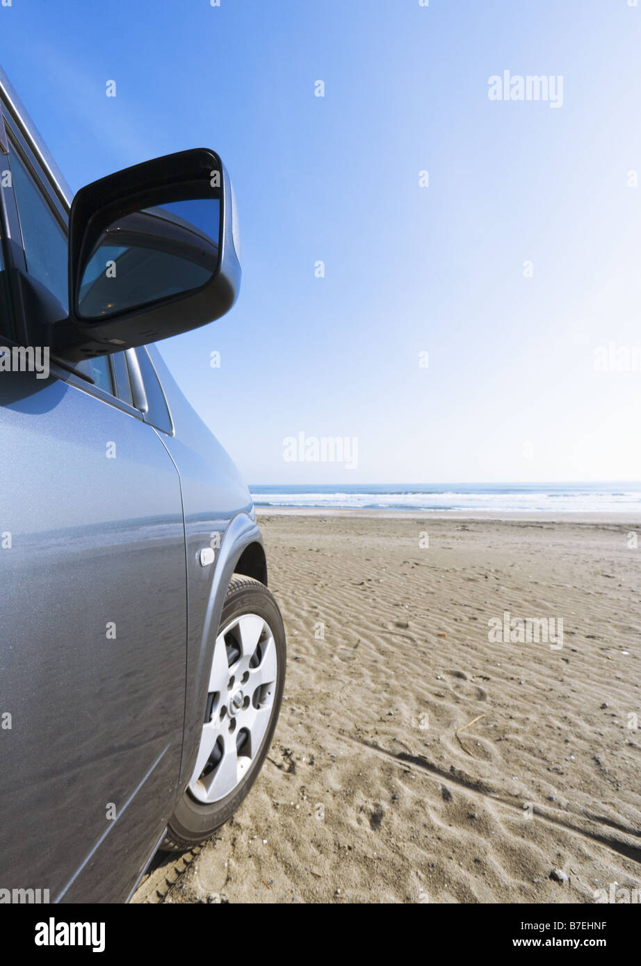 Car on a sandy beach Stock Photo - Alamy