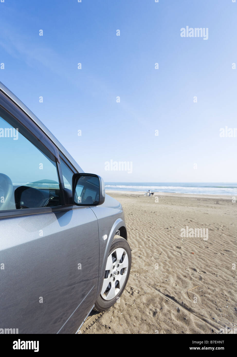 Car on a sandy beach Stock Photo - Alamy