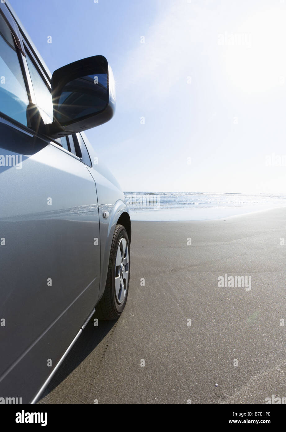 Car on a sandy beach Stock Photo - Alamy