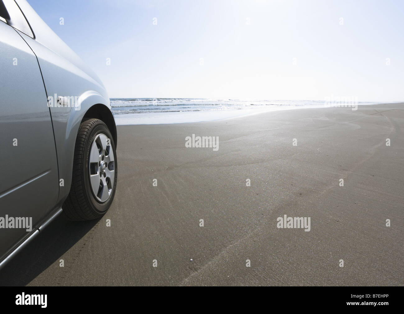 Car on a sandy beach Stock Photo - Alamy