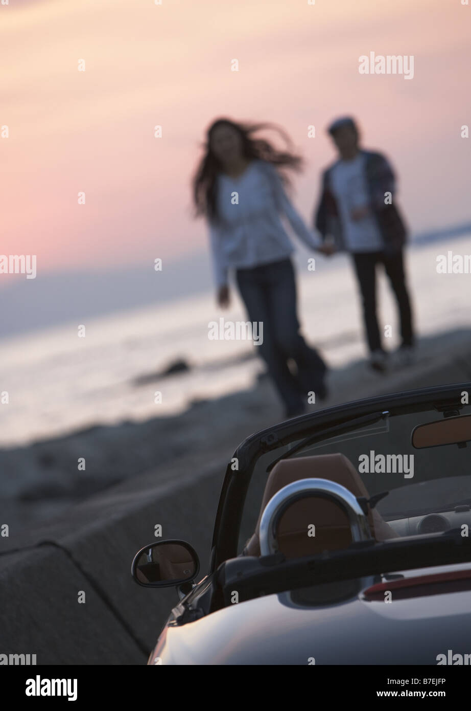 Couple and a car Stock Photo - Alamy
