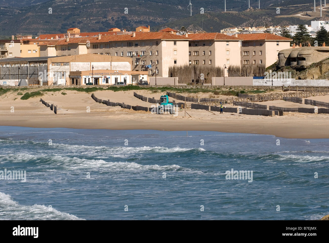 Tarifa town beach having sand erosion barriers erected during winter ...