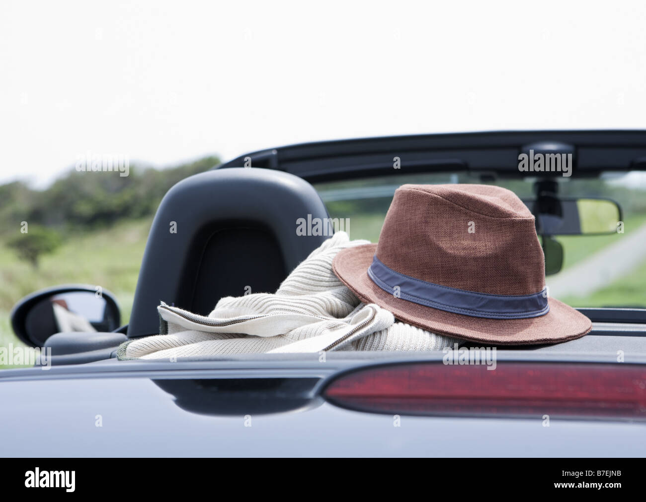 Hat on the convertible Stock Photo - Alamy