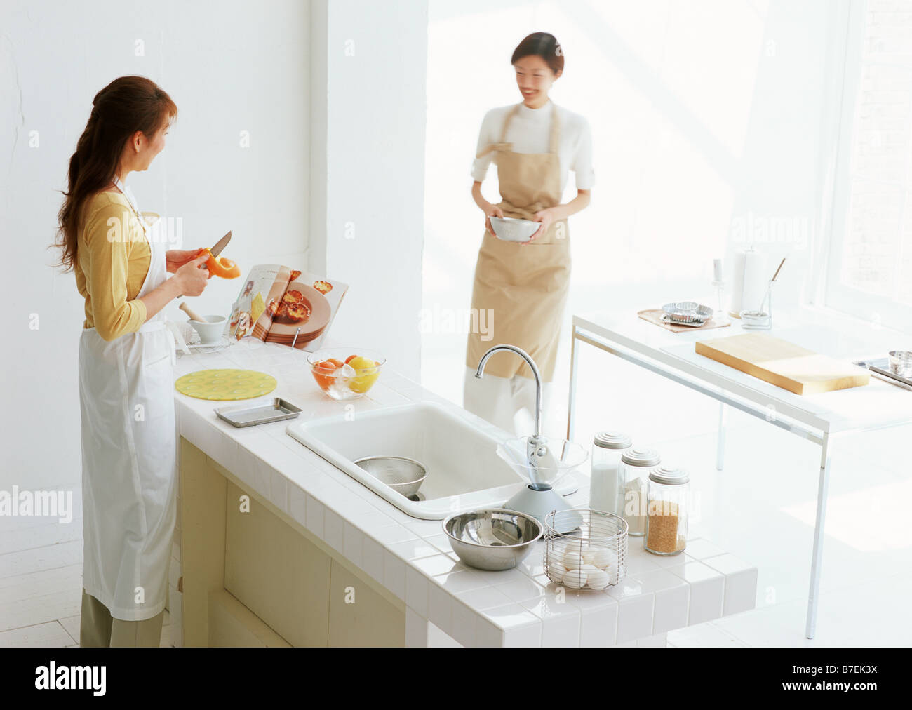 Women in kitchen Stock Photo - Alamy