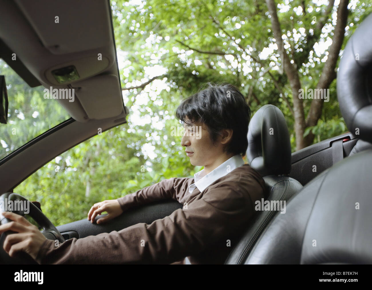 A man getting in a car Stock Photo - Alamy