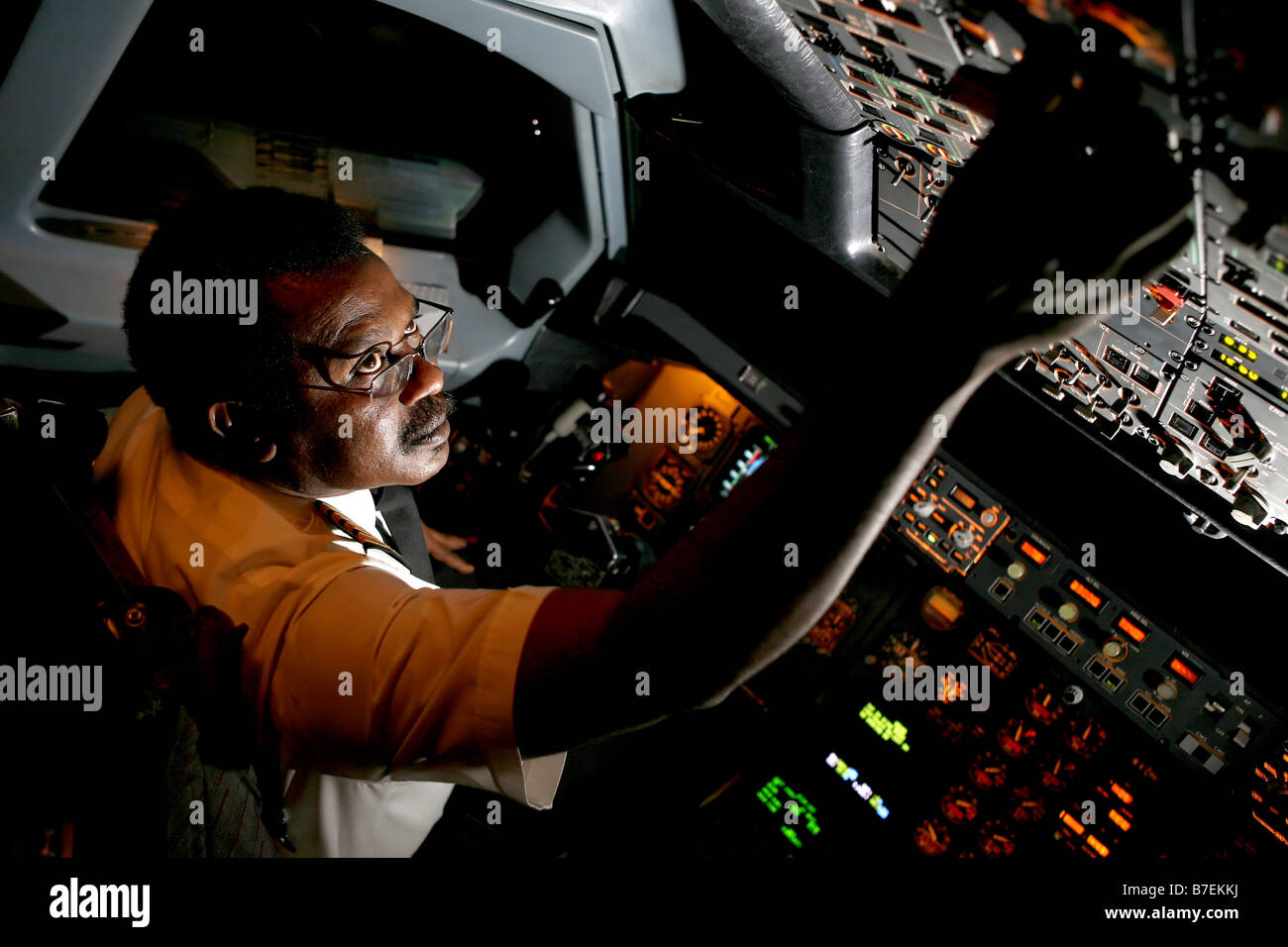 A pilot prepares for landing in midair photographed from inside the ...