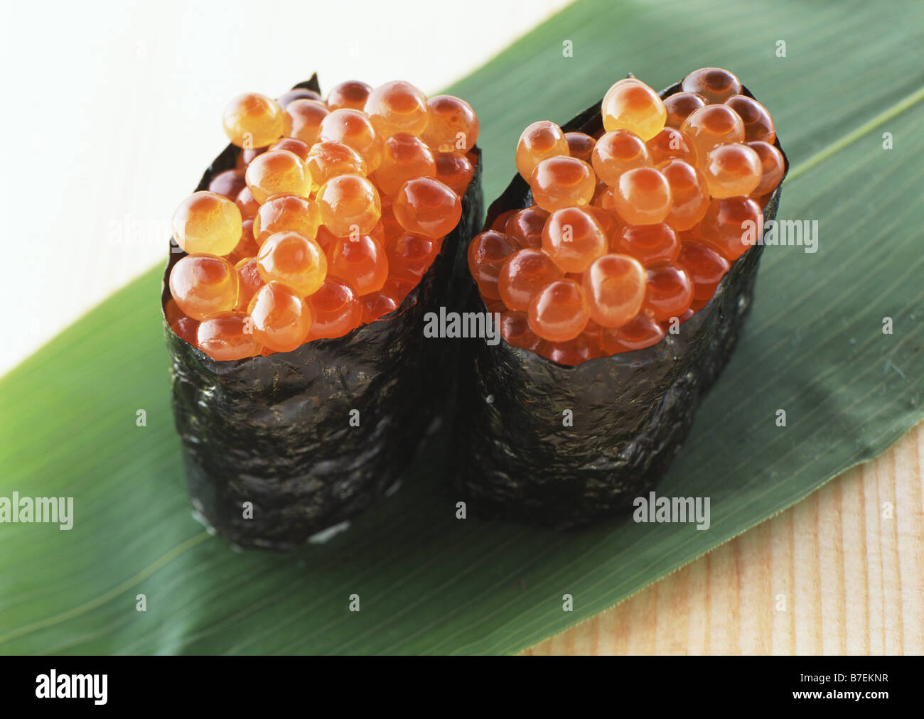 Salmon roe sushi on bamboo leaf Stock Photo - Alamy