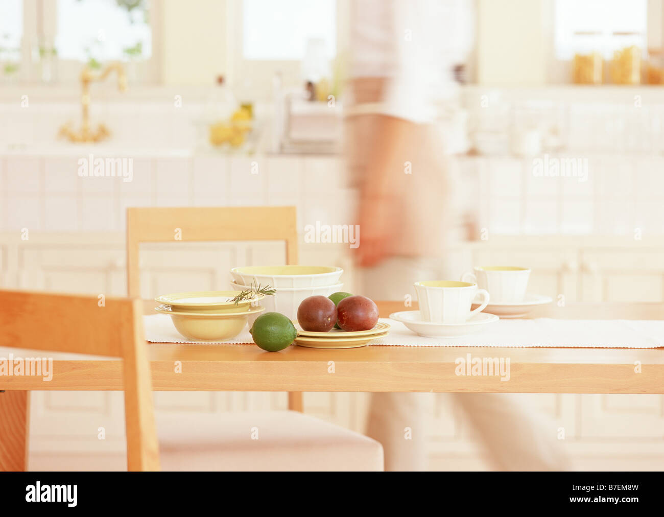 Woman and dining table Stock Photo - Alamy