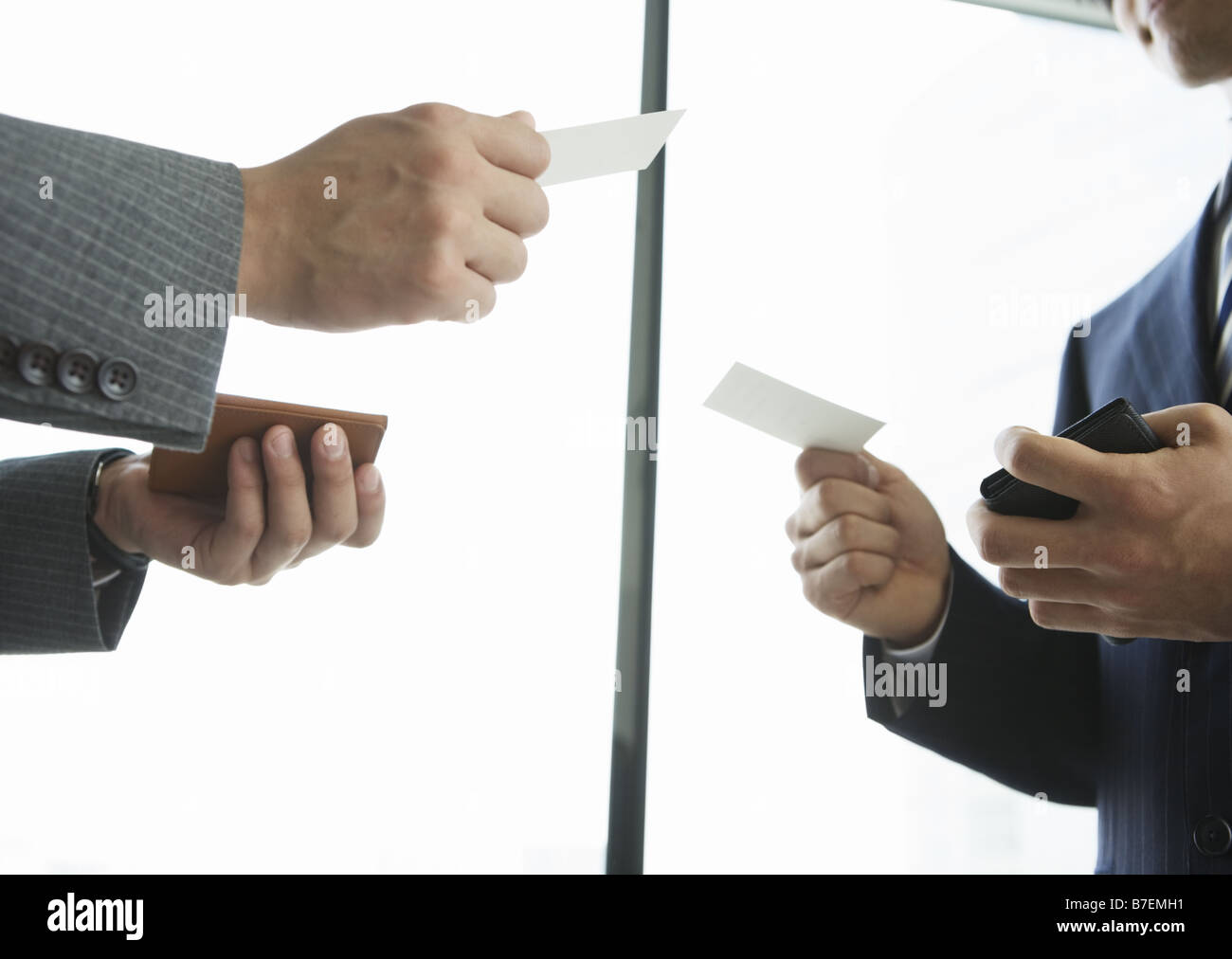 Exchanging business cards Stock Photo - Alamy