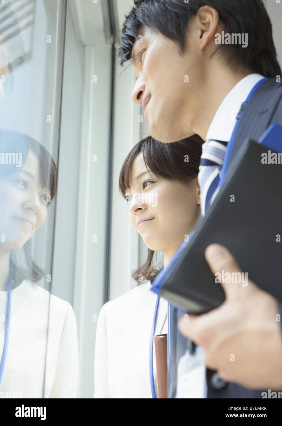 Office workers looking out window hi-res stock photography and images ...