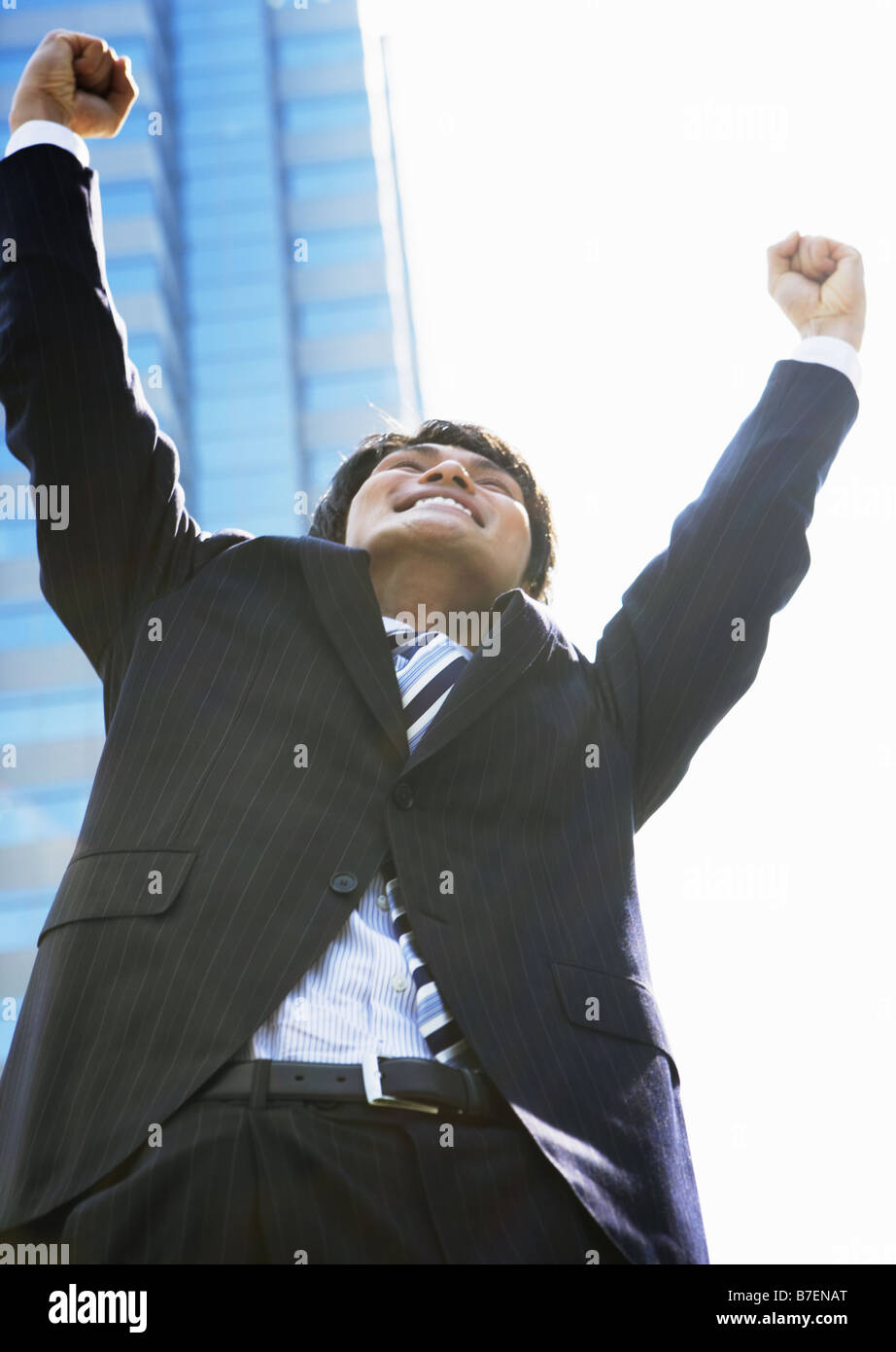 Businessman with victory pose Stock Photo - Alamy