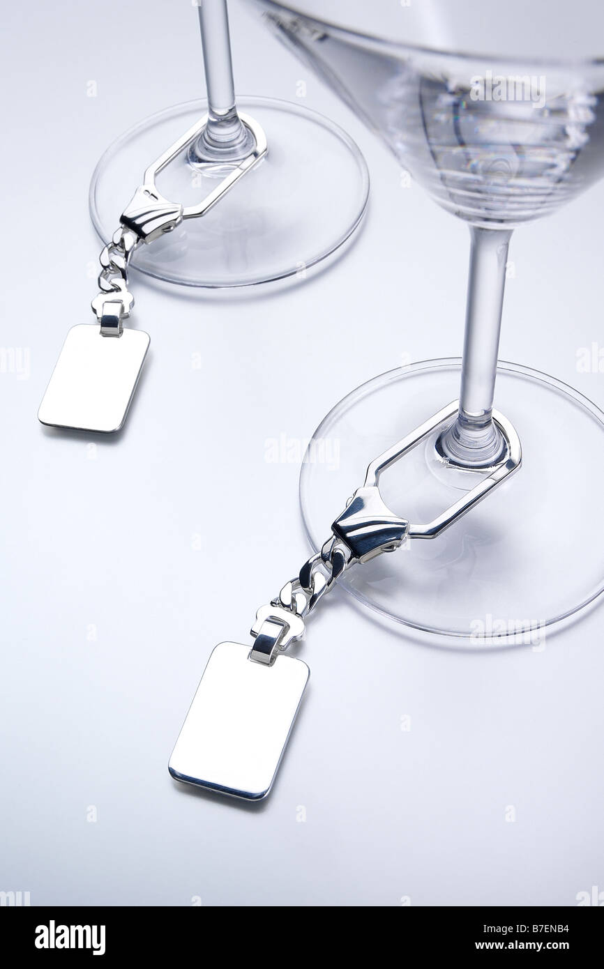 Two Keychain coupled to the glass on a white background, Close-up Stock ...
