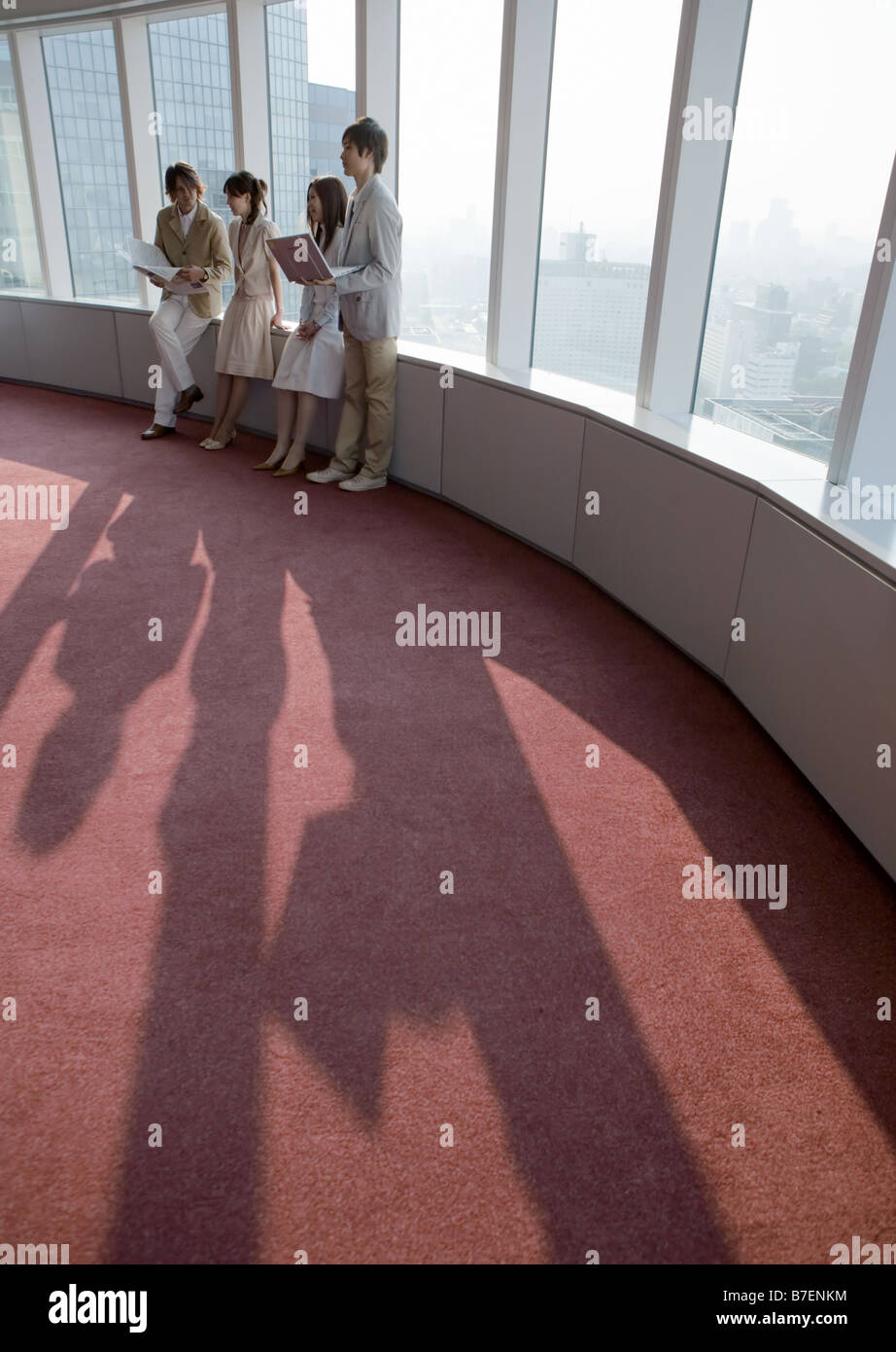 Team four people stand hi-res stock photography and images - Alamy