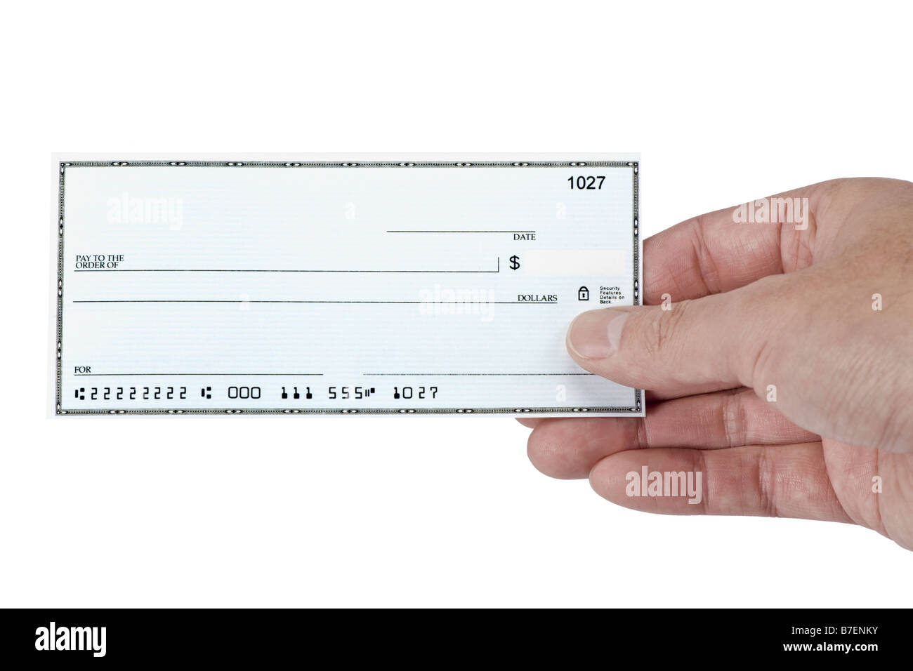 A blank check held in a man s hand Stock Photo - Alamy