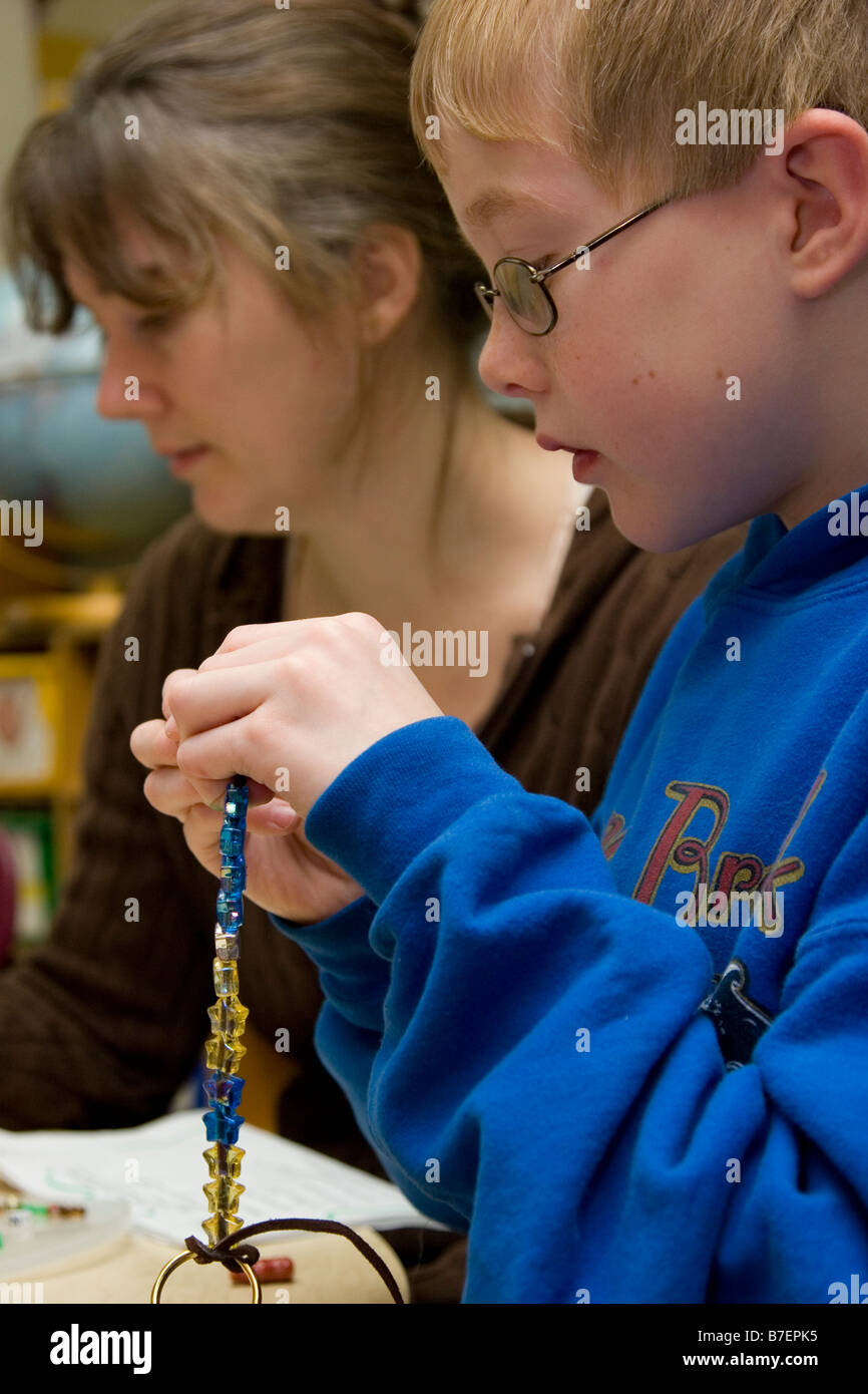 Beading woman hi-res stock photography and images - Alamy