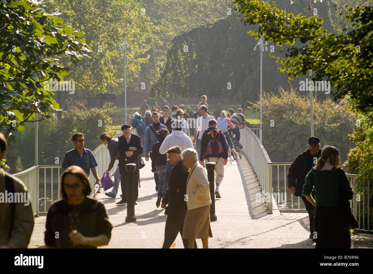People walk over bridge in St James s Park London UK Stock Photo - Alamy