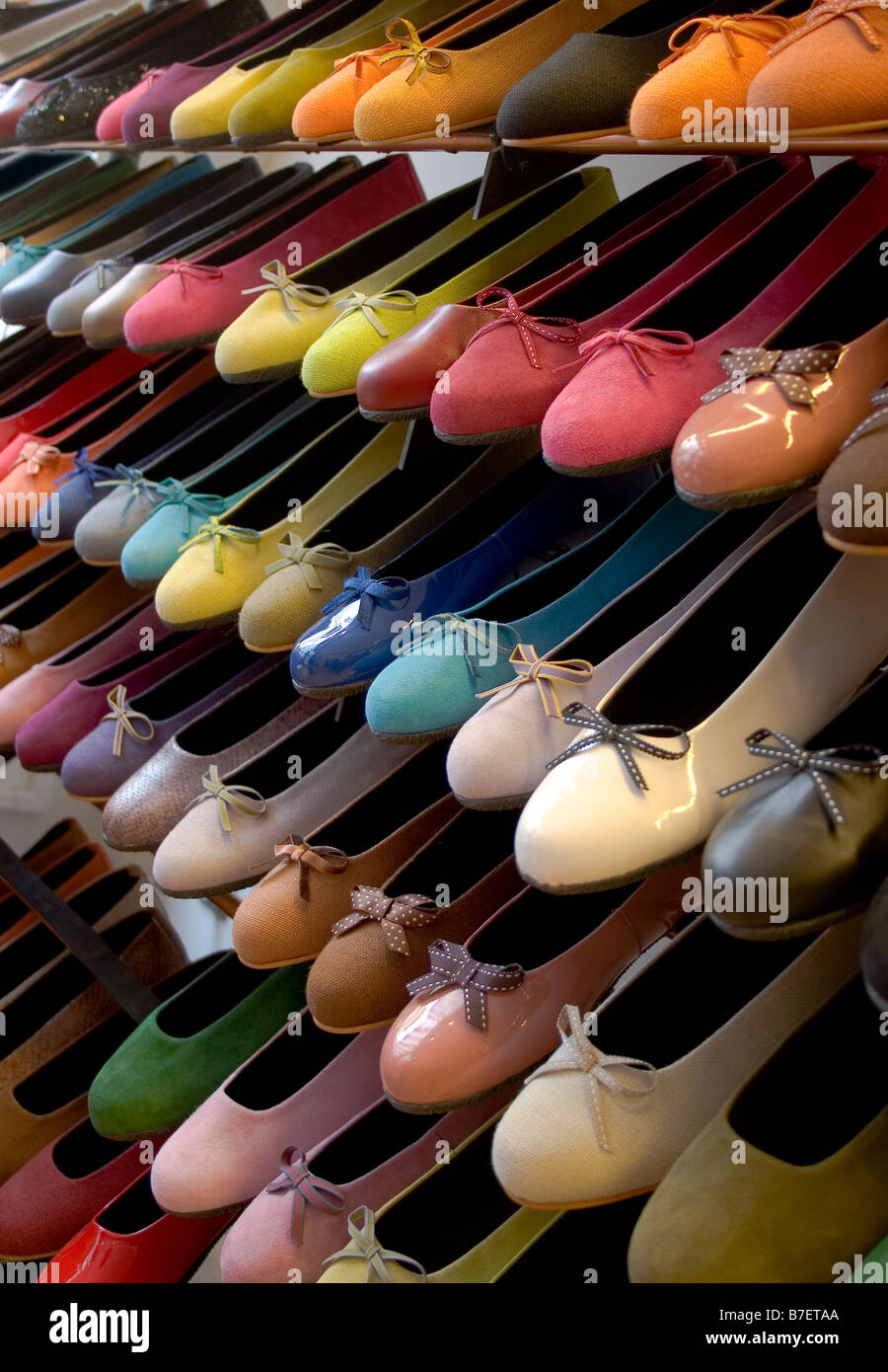 ladies shoes in various colors in rows Stock Photo - Alamy
