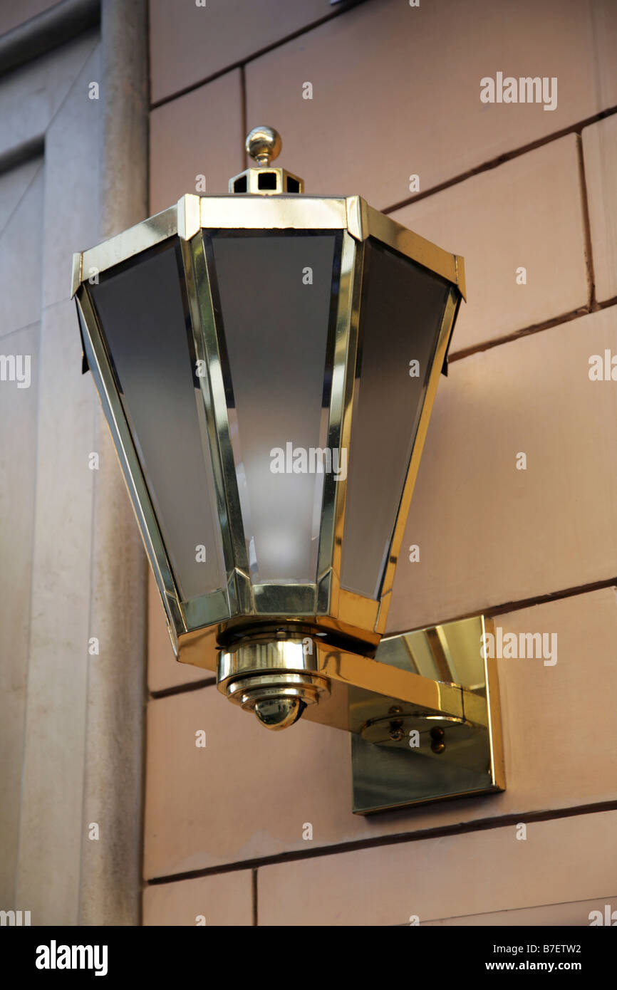 Street lamp on the wall of house Stock Photo - Alamy