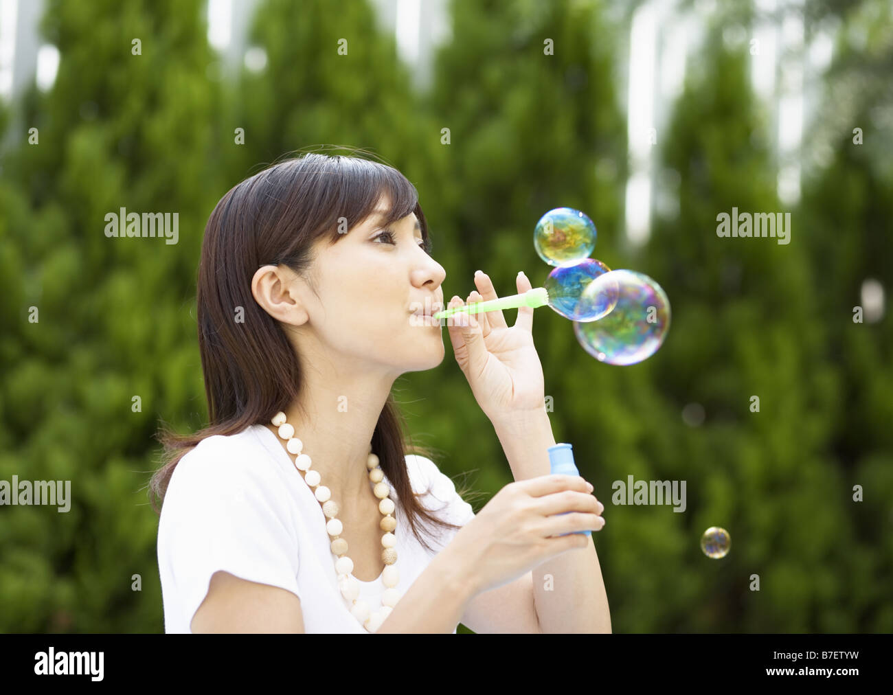 A woman blowing bubbles Stock Photo - Alamy