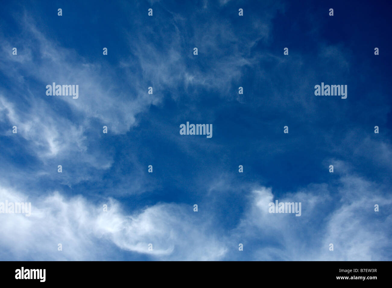 Blue sky and wispy stratocirrus or cirrus clouds Stock Photo - Alamy
