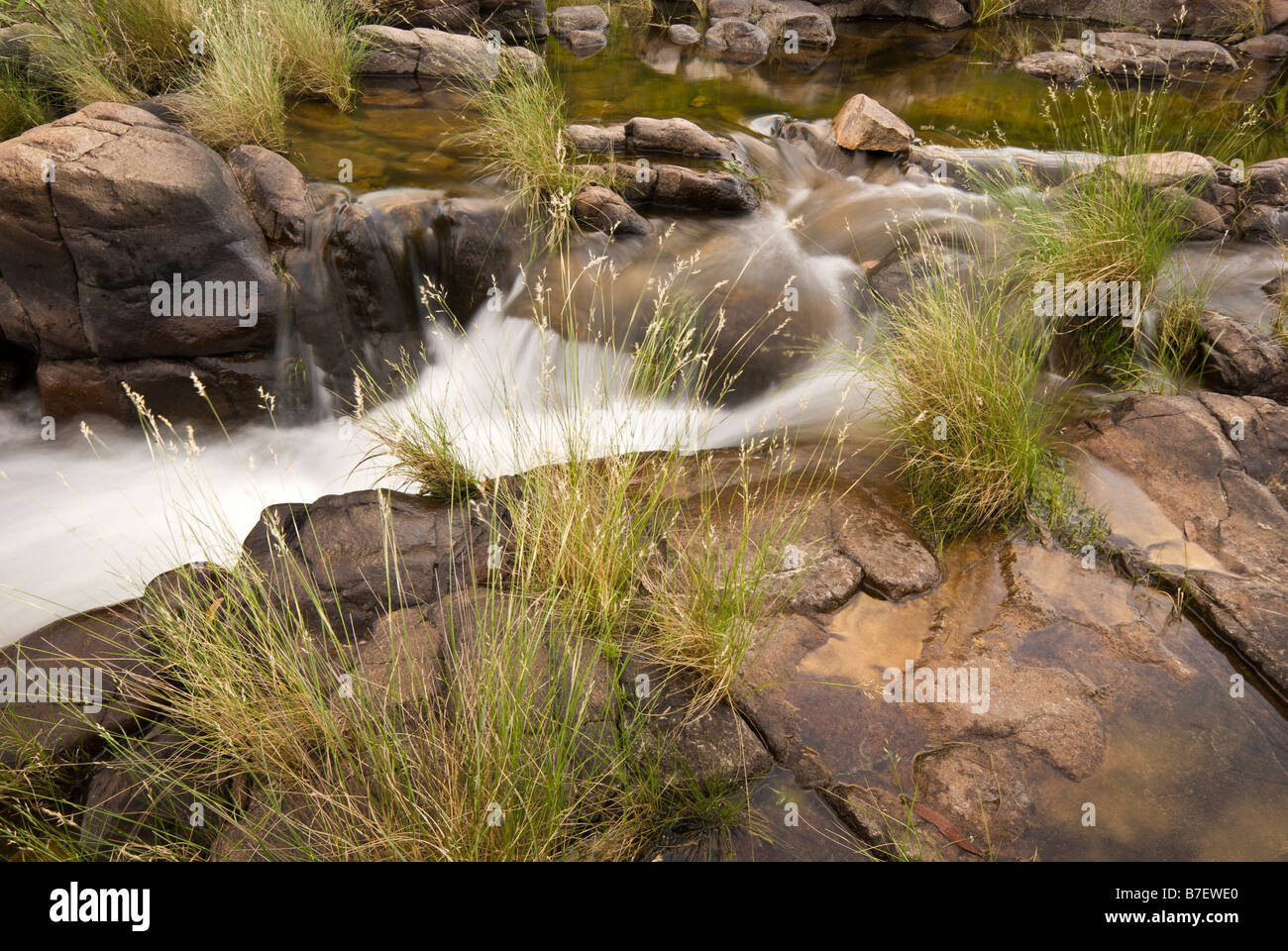 Water gently flowing over rocks from Maguk Falls in Kakadu National ...