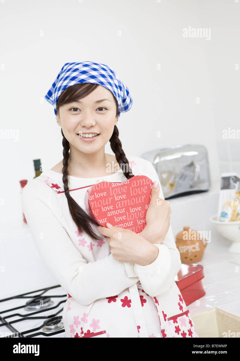 A woman holding a present Stock Photo - Alamy