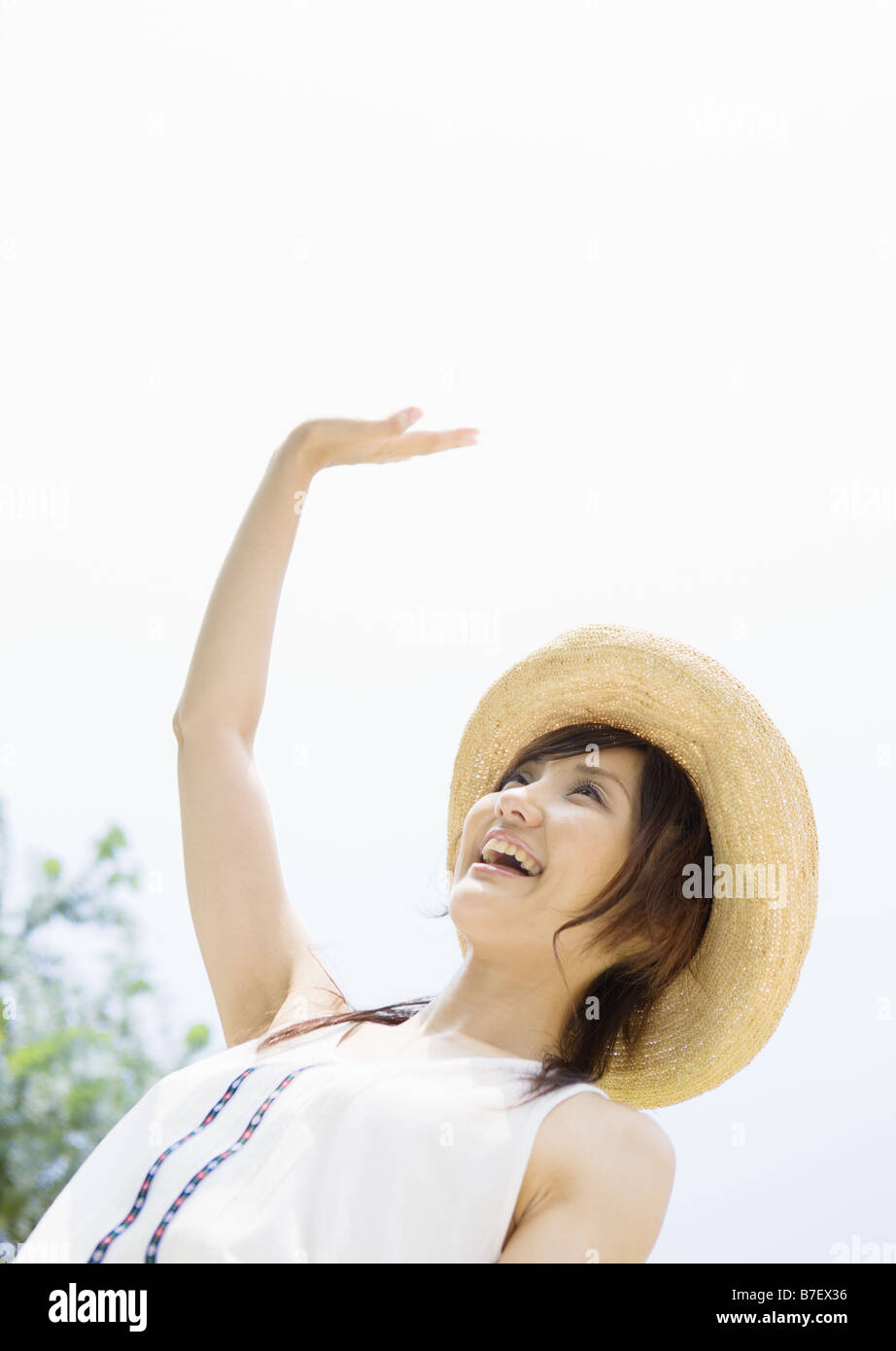 A woman waving hand Stock Photo - Alamy